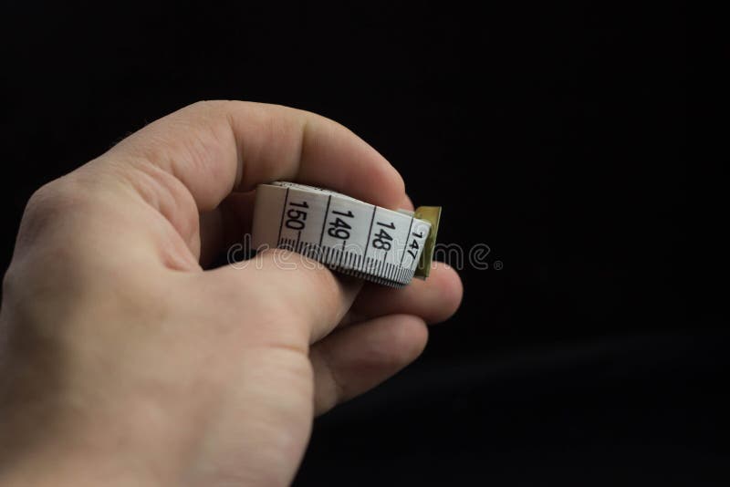 Measuring Tape Thread on a Black Background Stock Photo - Image of ...