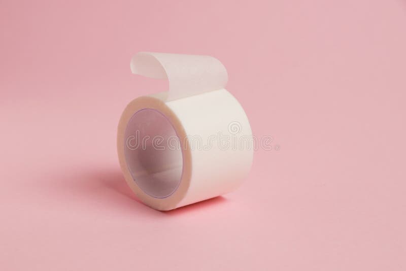 White Medical Patch on a Paper Base, for Applying Bandages, on a Pink ...