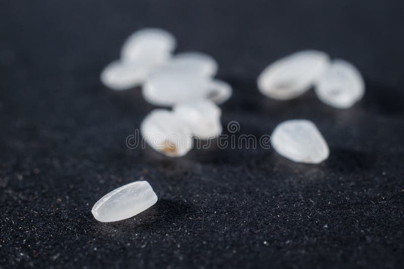 White Medium Grain Peeled and Polished Rice on a Dark Background, Close ...