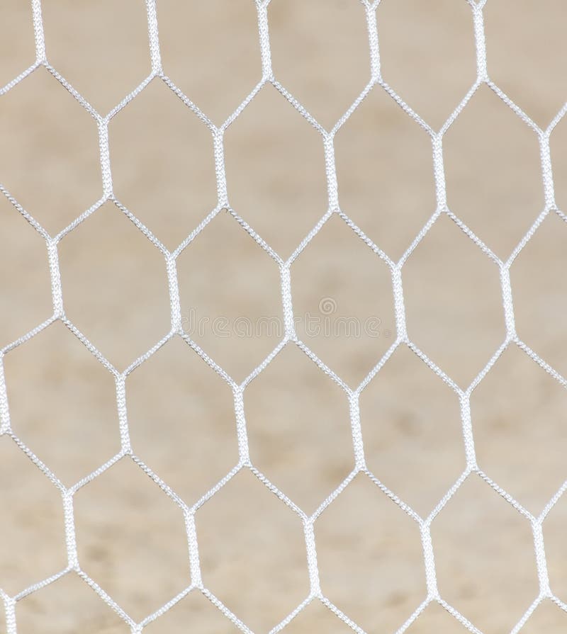 A White Mesh with a Pattern of Squares and Triangles Stock Photo ...