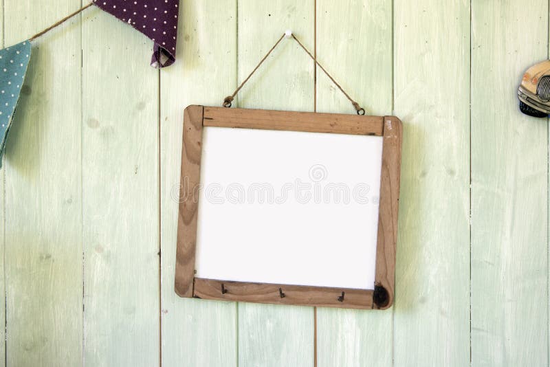 White Message Board Hanging on Retro Green Wooden Wall Stock Image ...