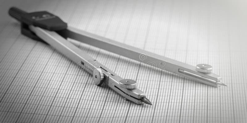 White Metal Compasses Over Empty Graph Paper Stock Image - Image of ...