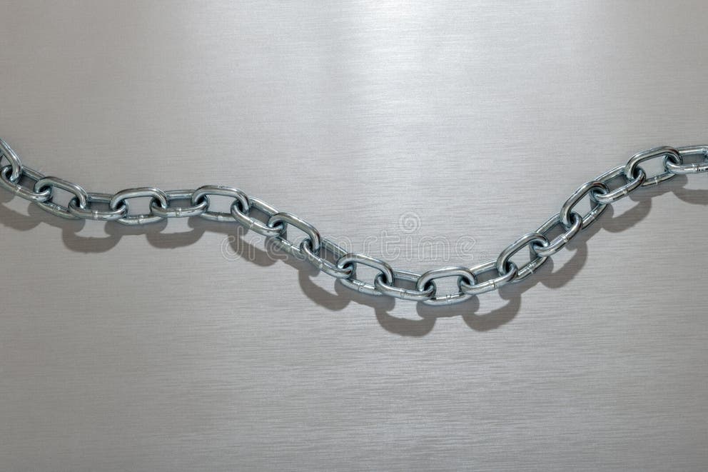 White Metal Customized Chain with Shadow Placed on Silver Surface Stock ...