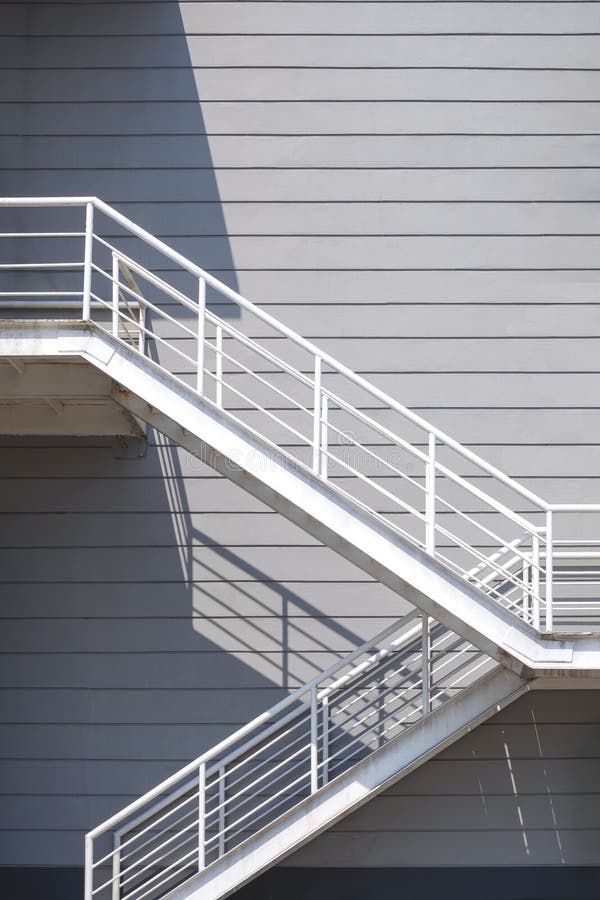 White Metal Fire Escape on Gray Industrial Office Building Wall ...
