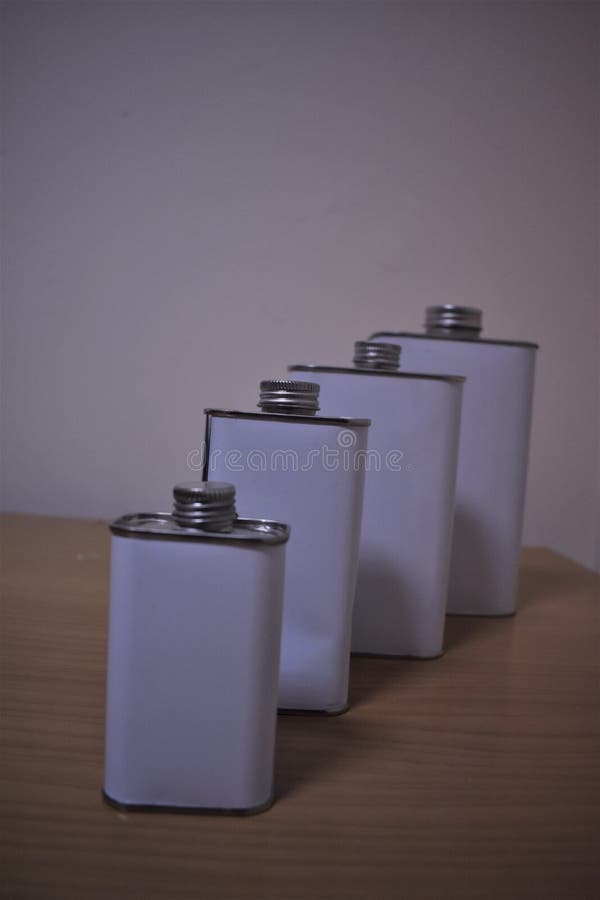 White Metal Liquid Containers Lined Up Stock Photo - Image of closed ...