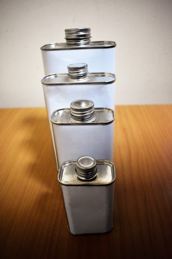 White Metal Liquid Containers Lined Up Stock Image - Image of metallic ...