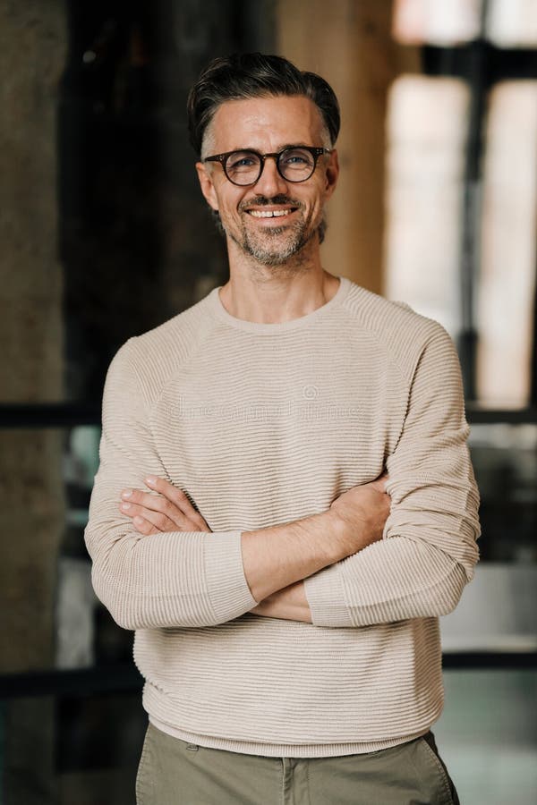 Middle-aged Man Smiling at Camera while Standing Indoors Stock Image ... Middle-aged Man Smiling at Camera while Standing Indoors Stock Image ...