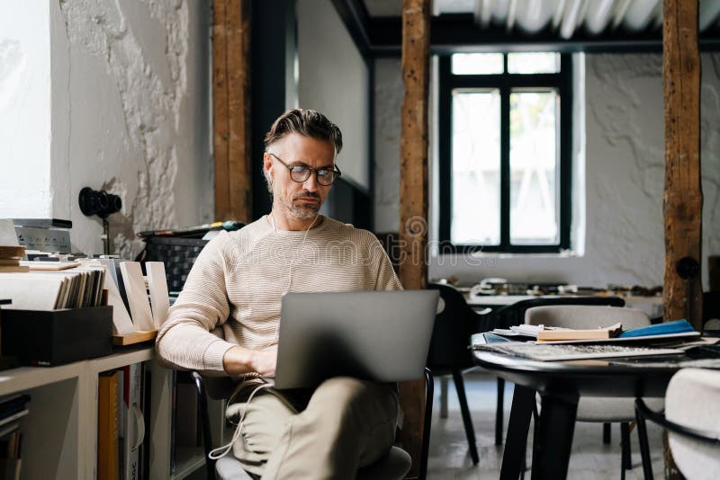 White Middle-aged Man Using Laptop Computer in Office Stock Photo ...