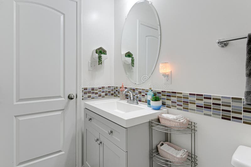 White Minimal Bathroom Interior with Multi Colored Accent Tiles and ...