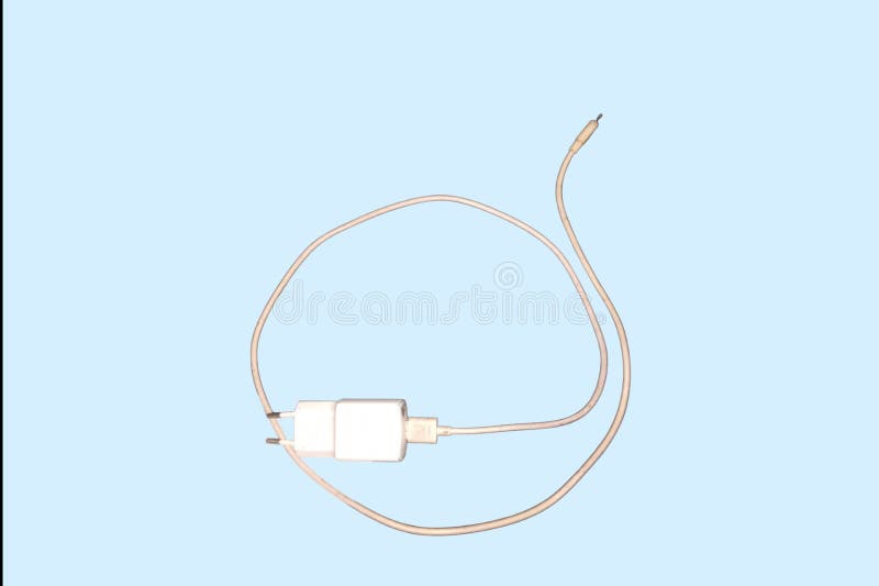 White Mobile Phone Charger Complete with USB Cable Seen from Above ...