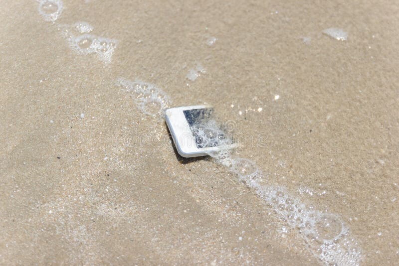 White Mobile Phone Floated To the Sea Stock Image - Image of phone ...