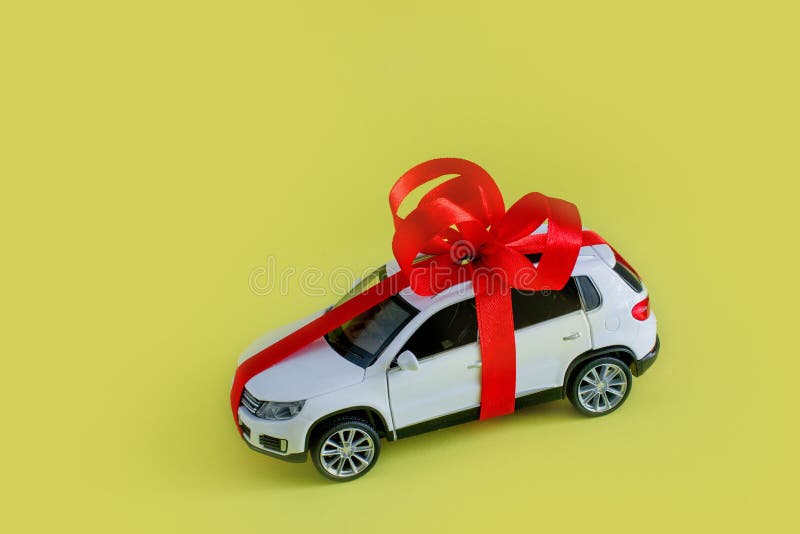 White Model Car with Bow on a Yellow Background. Car As Gift, Surprise ...