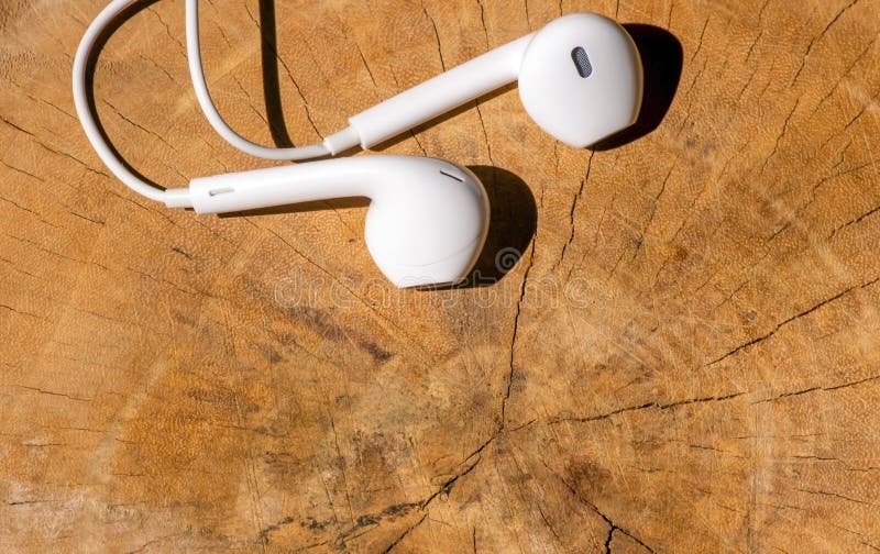 White Modern Earphones, Headset, on Wood Table Stock Image - Image of ...