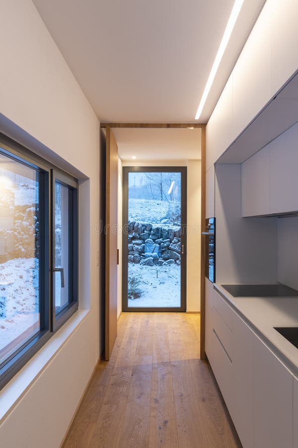 White Modern Kitchen with Windows of View of Nature and Snow Stock ...