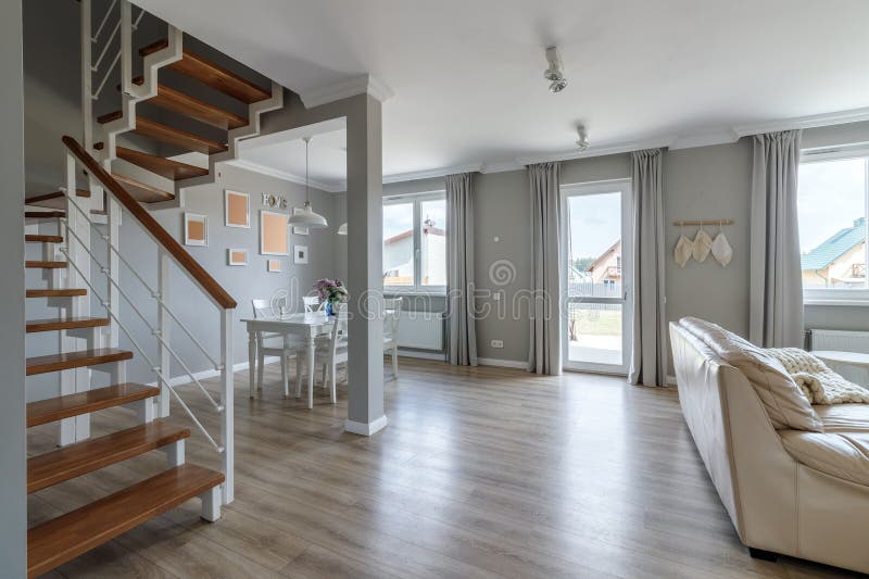 White, Modern Open Space with Wooden Furniture Set Stock Photo - Image ...