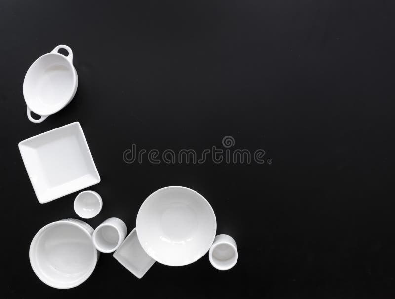 White, Modern Tableware in Various Designs on a Black Background Stock ...