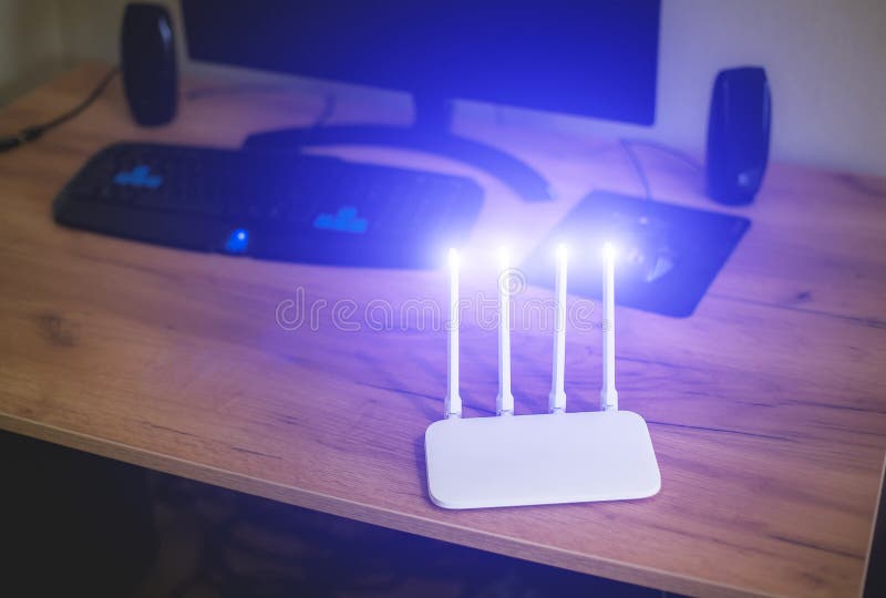 White Modern Wi-Fi Router on the Table in Room. Wireless Ethernet ...