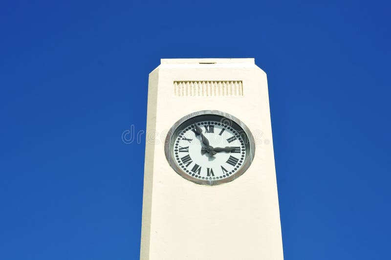 White monument with clock stock image. Image of place - 46775175