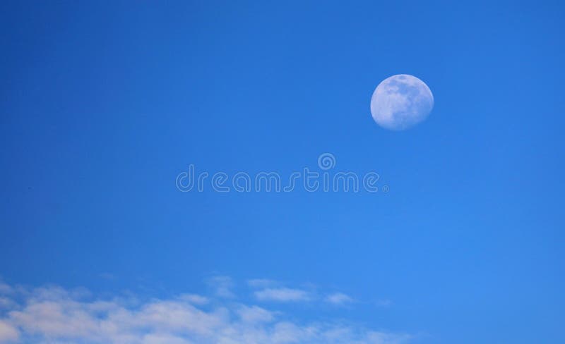 White Moon almost Full and Blue Sky with Some Clouds at Daytime Stock ...