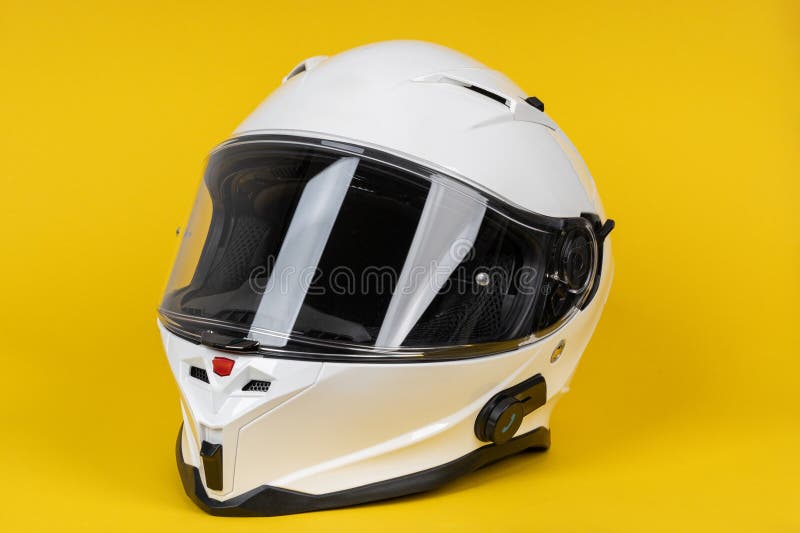 White Motorcycle Carbon Integral Crash Helmet on Yellow White. High ...