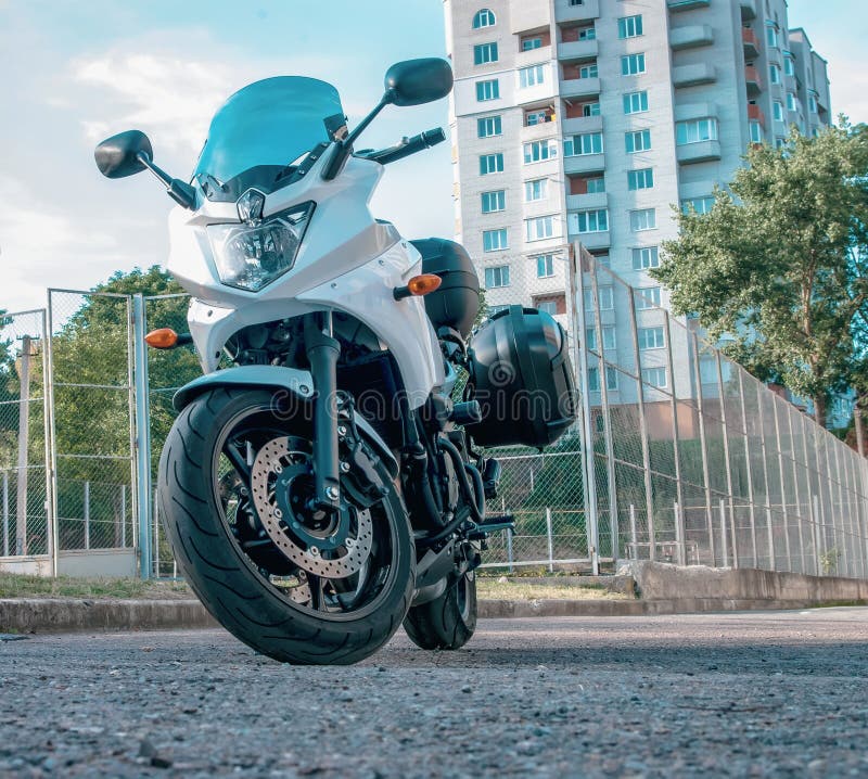 White Motorcycle Stands on a Platform in the City Stock Photo - Image ...