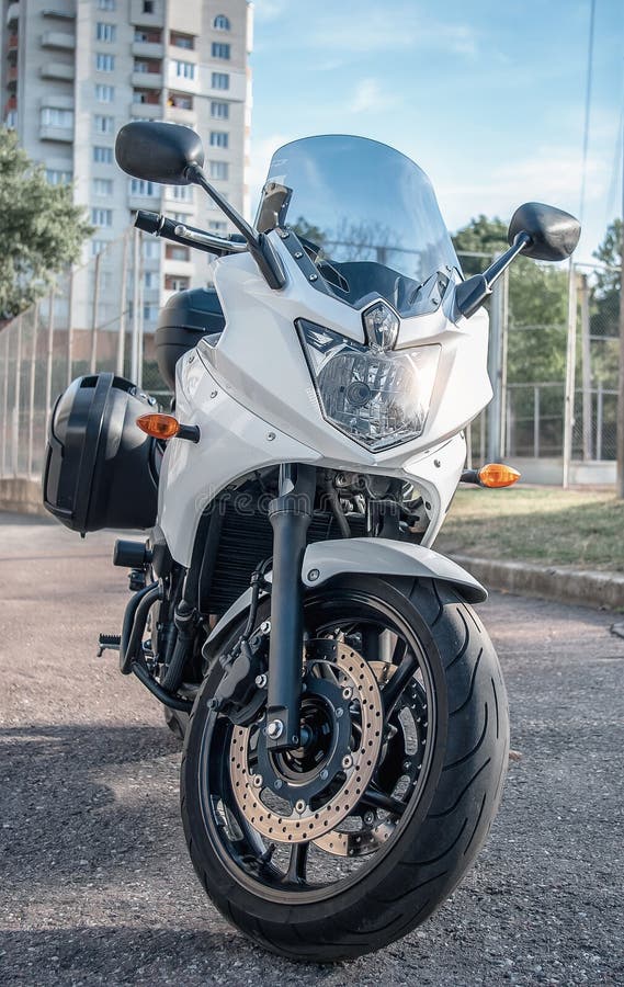 White Motorcycle Stands on a Platform in the City Stock Photo - Image ...