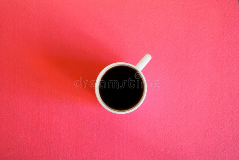 White Mug with Black Coffee on a Pink Surface. View from Above Stock ...