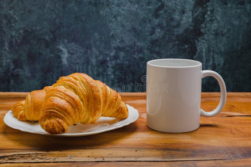 White Mug and Croissants on Wooden Table. Stock Photo - Image of ...