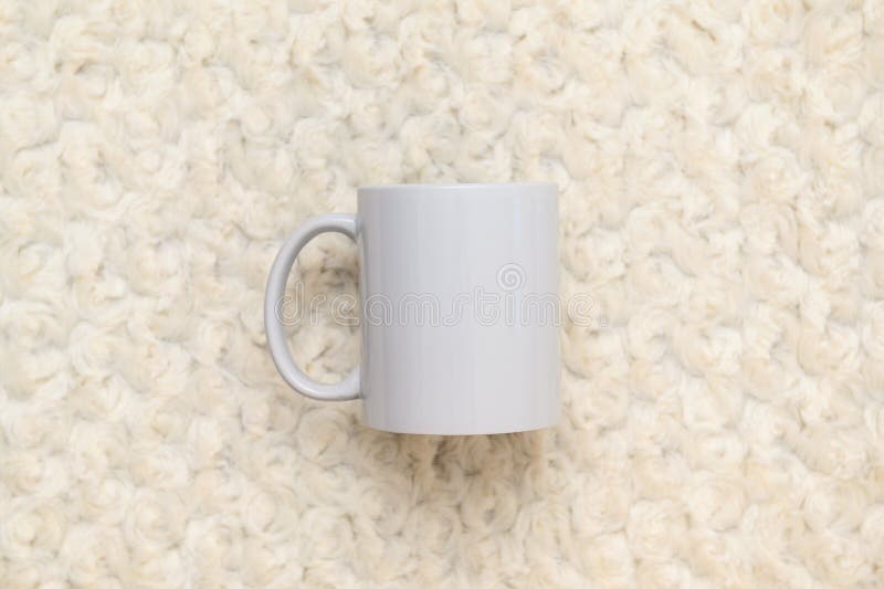 White Mug on White Fur Texture. Dishes for Tea and Coffee. View from ...