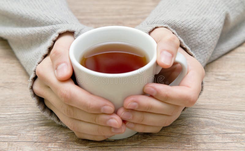 Hands Holding Cup of Tea stock image. Image of blue, beverages - 46931529