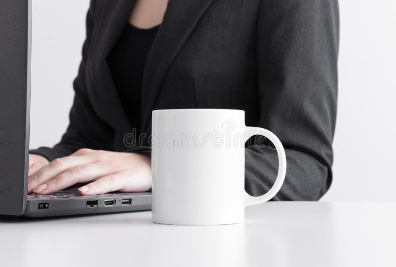 White Mug Mockup with Woman Working on a Computer Stock Photo - Image ...