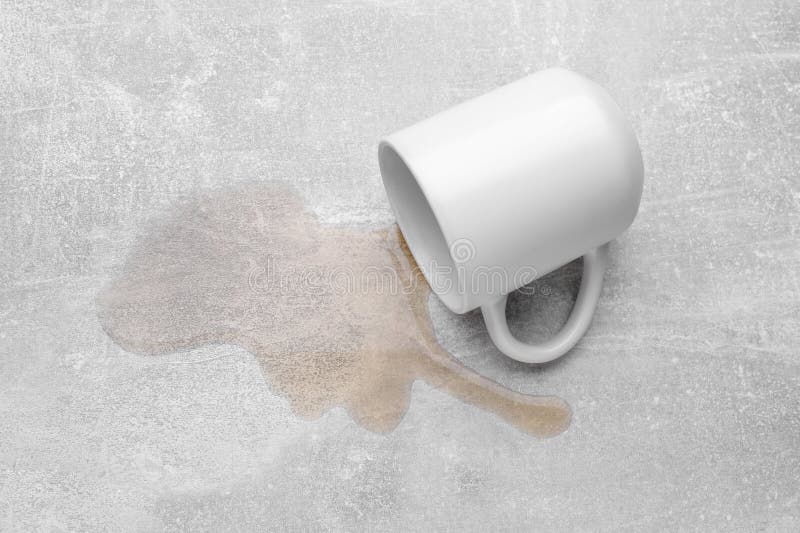 White Mug with Spilled Liquid on Light Grey Surface, Above View Stock ...