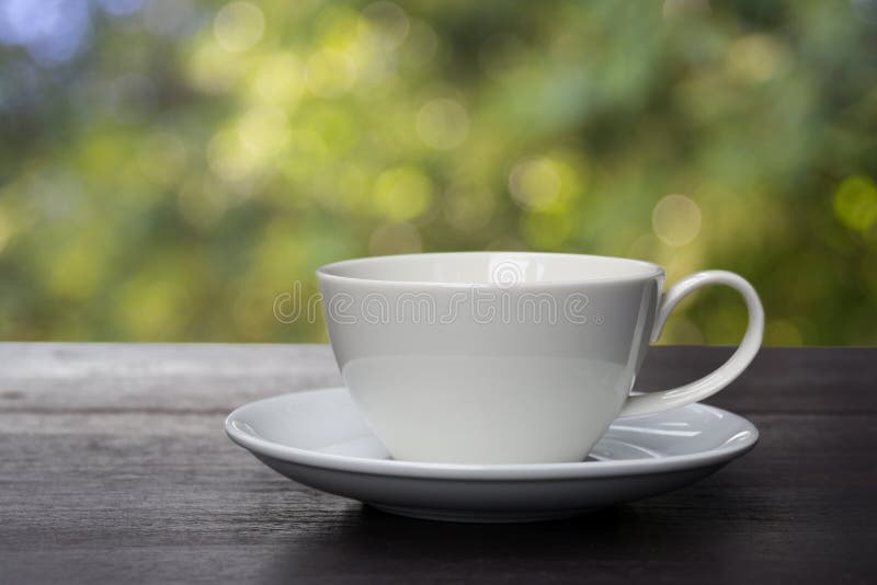 White mug on wooden table stock photo. Image of design - 104372164