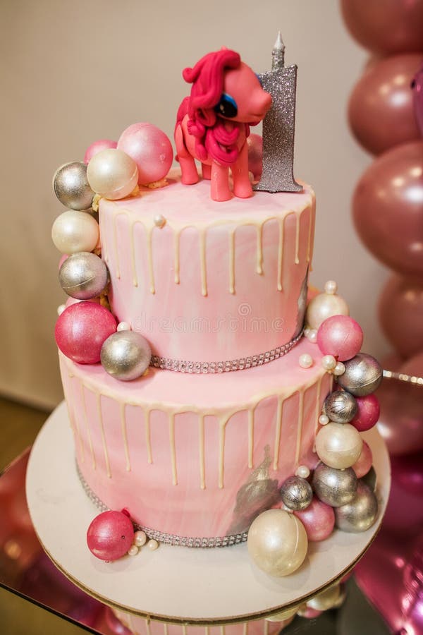 White Multi Level Wedding Cake with Orange Lilies Flower Decorations ...