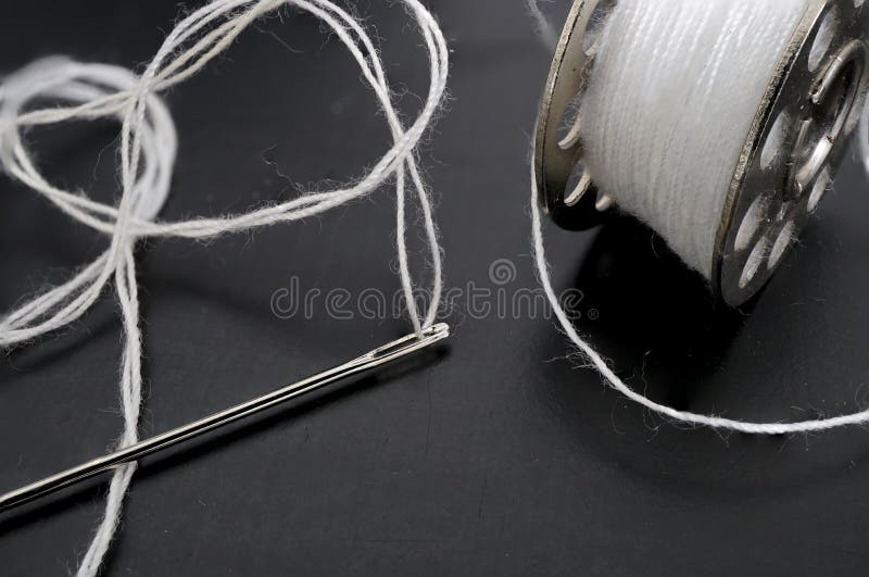 White Needle and Thread on a Black Background Stock Image - Image of ...