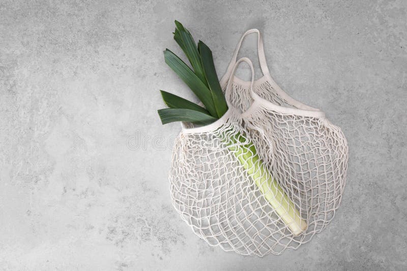 White Net Bag with Leek on Light Grey Table Stock Photo - Image of ...