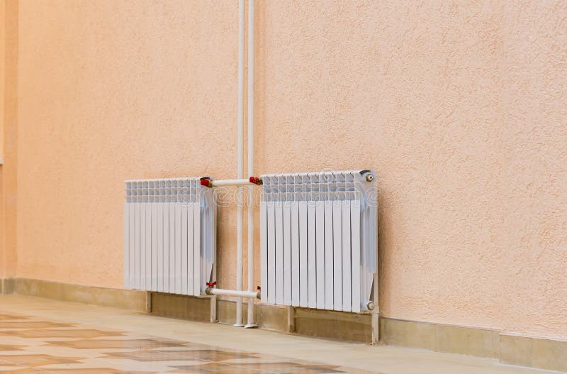 White New Radiator on Pink Wall in Building Stock Image - Image of heat ...