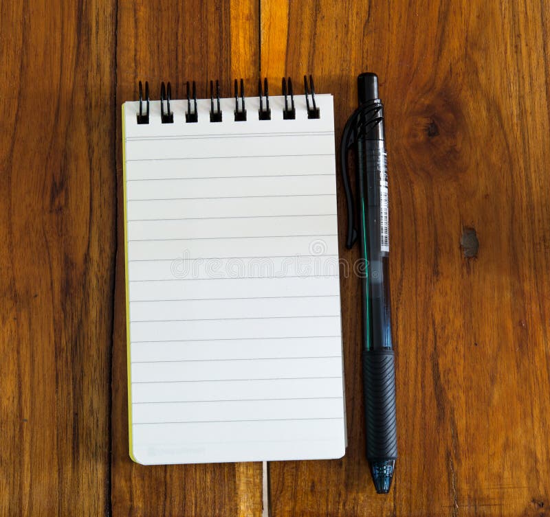 Note Book Black Pen on Wooded Table Stock Image - Image of paper, metal ...