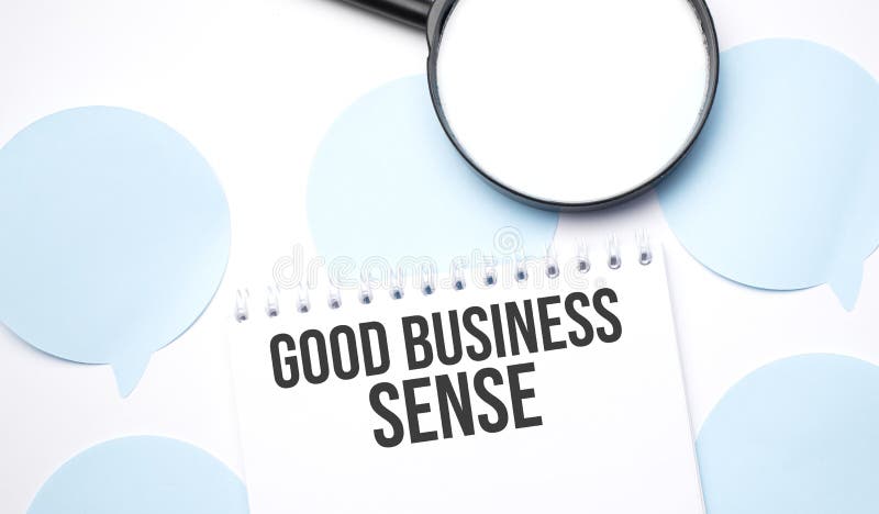 White Noteapad and Magnifier on Blue Speech Bubles. Text GOOD BUSINESS ...