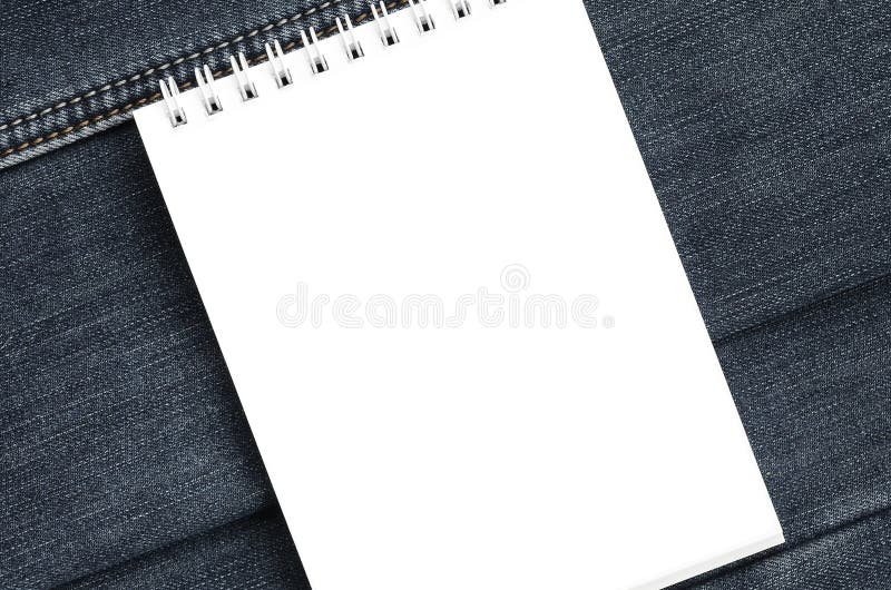 White Notebook with Clean Pages Lying on Dark Blue Jeans Backgro Stock ...
