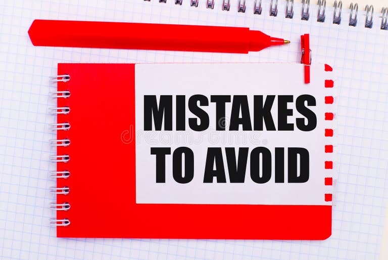 On a White Notepad, a Red Pen, a Red Notepad and a White Sheet of Paper ...