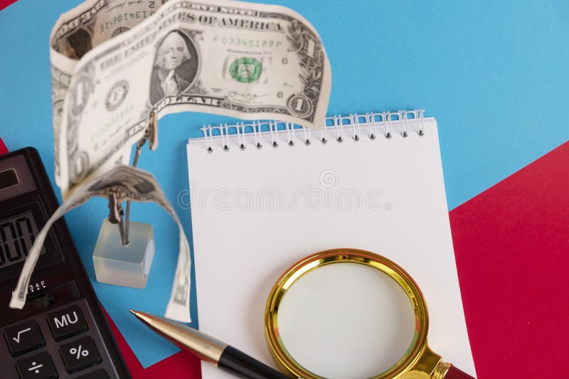 White Notepad with Stylish Pen, Magnifying Glass and Calculator on Red ...