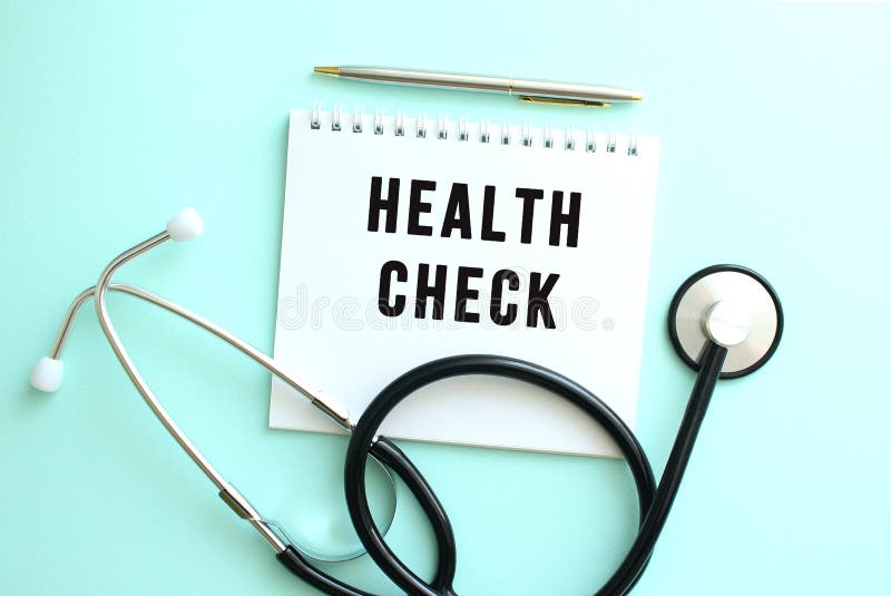 White Notepad with the Words HEALTH CHECK and a Stethoscope on a Blue ...