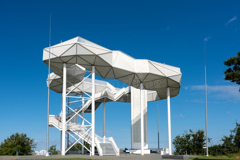 White Observation Tower with a Spiral Staircase and Blue Sky in the ...