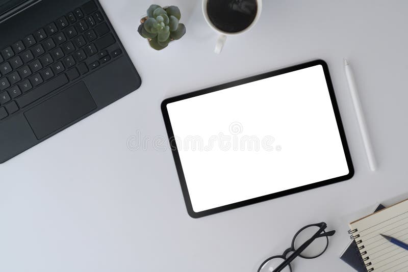 White Office Desk with Digital Tablet, Laptop, Glasses and Notebook ...