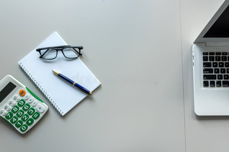 White Office Desk with Laptop Blank Notepad Calculator and Pen ...