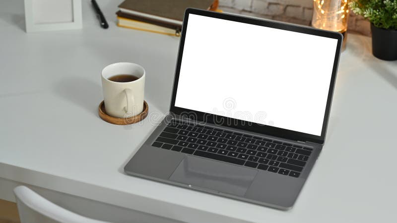 White Office Desk with Laptop Computer, Cup of Coffee and Potted Plant ...