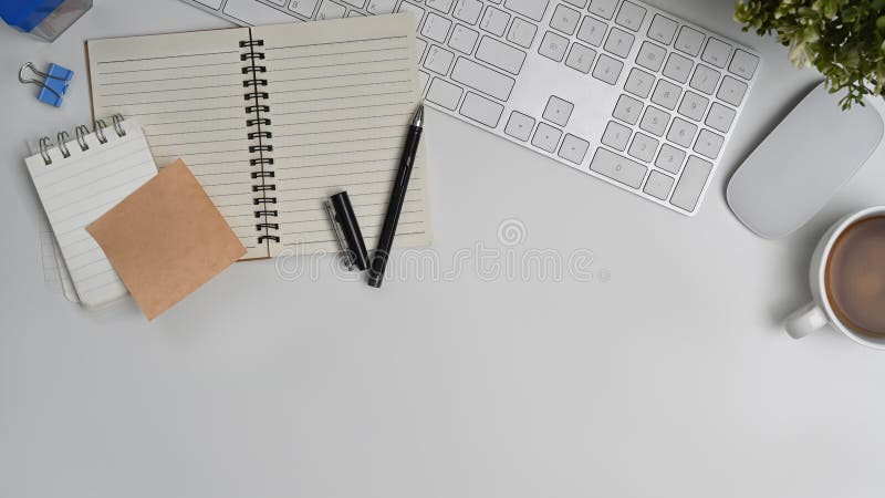 White Office Desk with Notepad, Sticky Note, Keyboard and Coffee Cup ...
