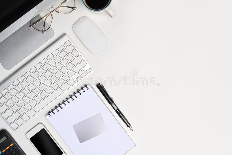 White Office Desk with Mobile Phone, Notebook, Calculator and Glasses ...