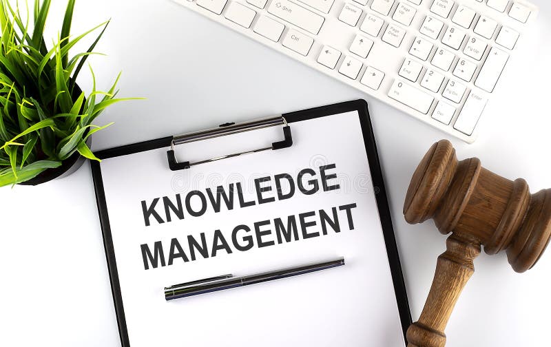 White Office Desk Table with Blank Sheet with Text KNOWLEDGE MANAGEMENT ...